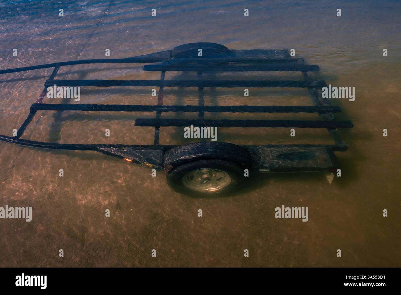 boat trailer at boat ramp submerged in water at a lake Stock Photo - Alamy