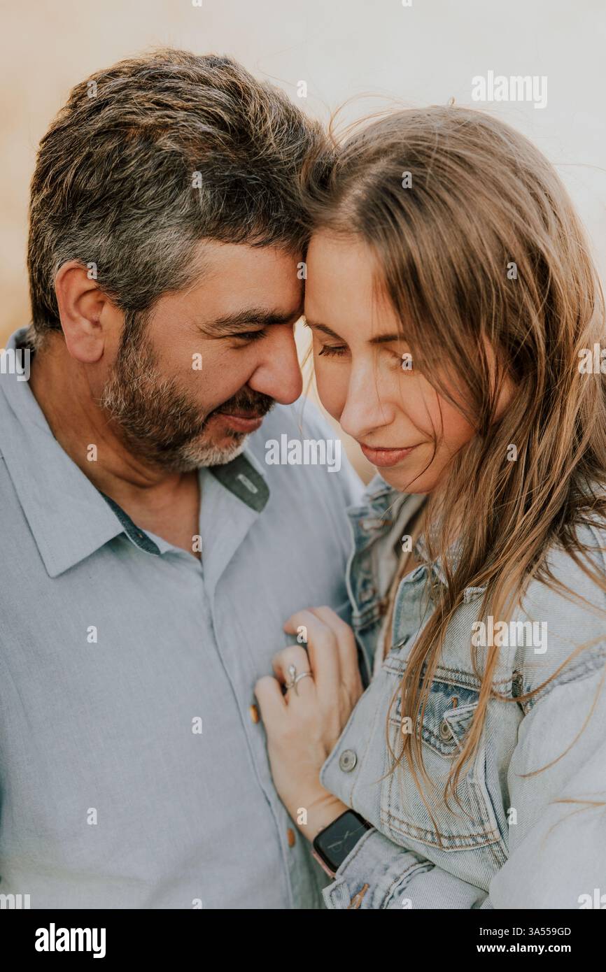 Romantic couple shares touching moment hi-res stock photography and ...