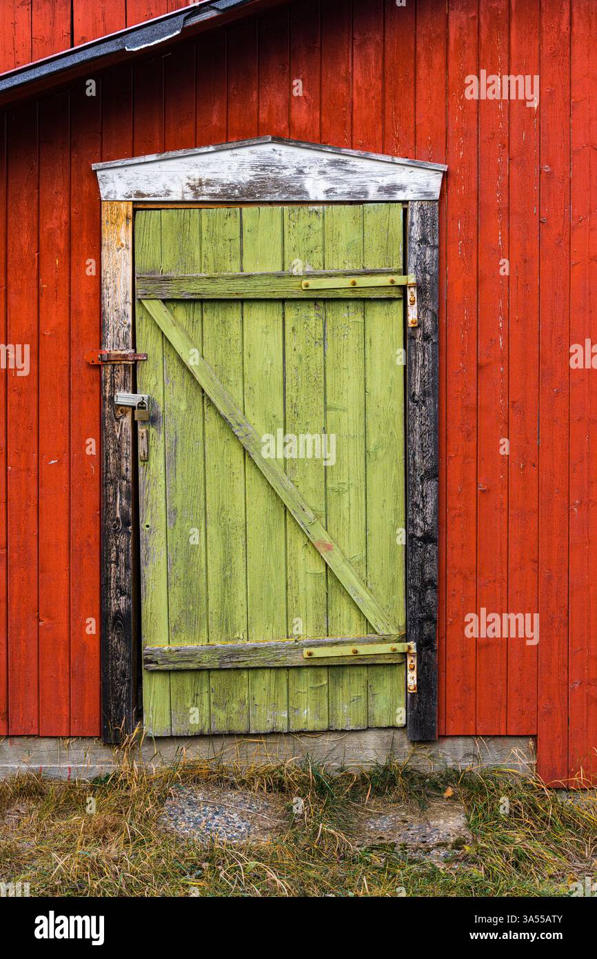 green door of a red outhouse Stock Photo - Alamy