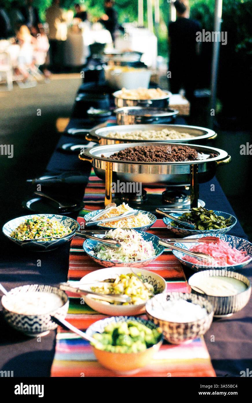 Colorful outdoor buffet of tacos with lots of dips, salsas and t Stock ...