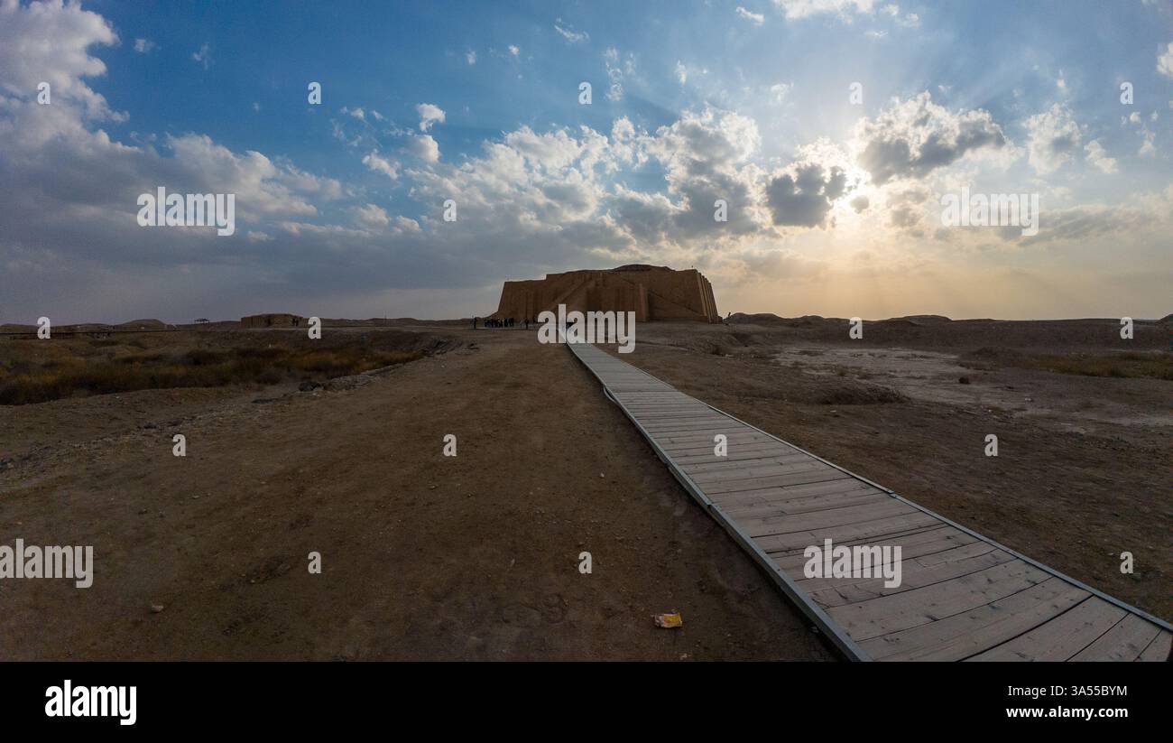 A wooden pathway leads to an ancient mud-brick structure city of Ur in ...
