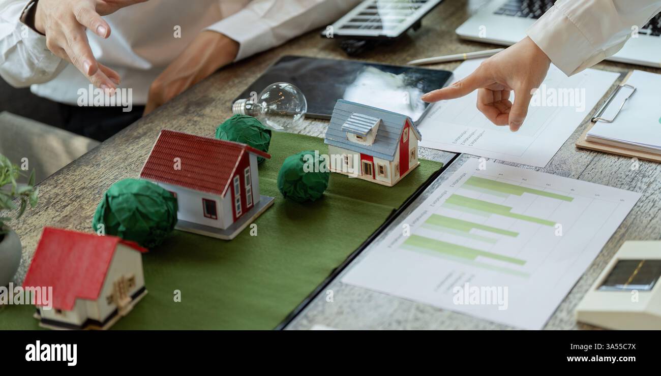 Sustainable Development and Housing Models. Professionals discussing ...