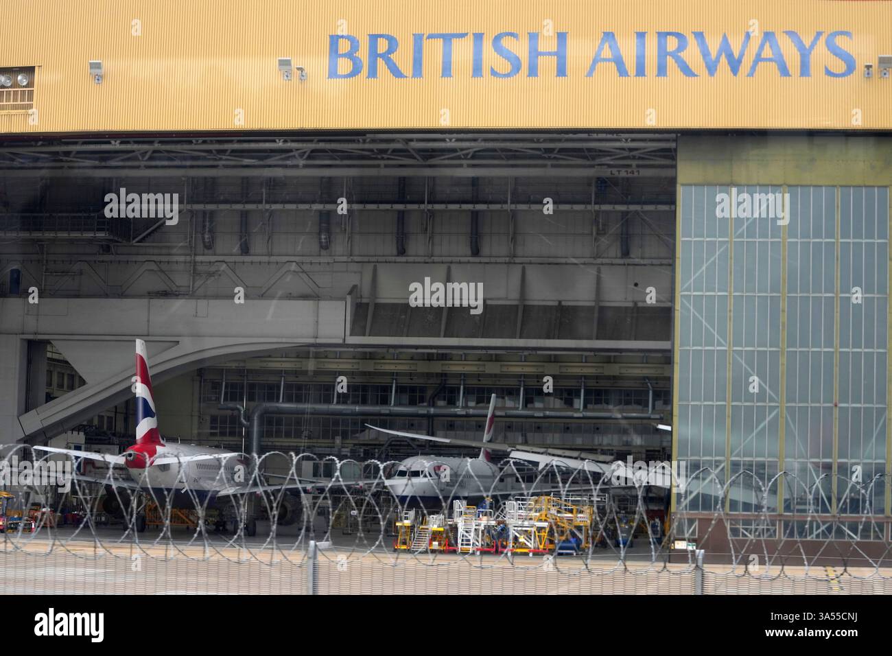 British Airways planes are sitting in a hangar as Britain's Heathrow ...