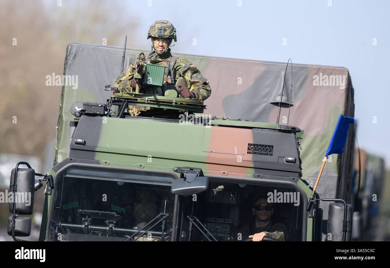 Hanover, Germany. 21st Mar, 2025. A convoy of Bundeswehr vehicles and ...
