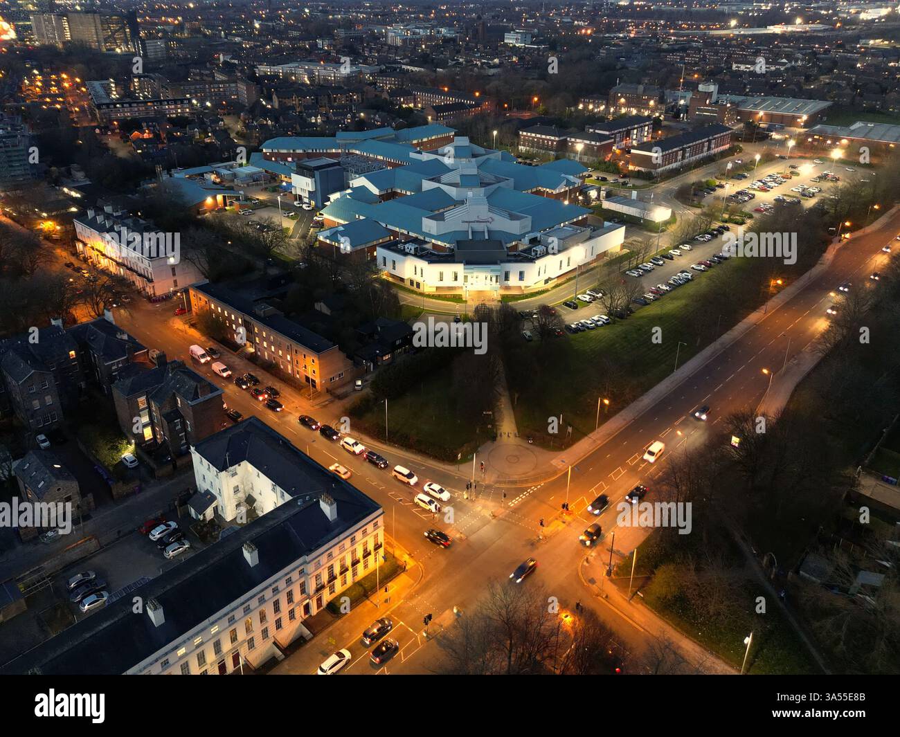 Aerial view of Liverpool Women's Hospital at dusk, featuring historic ...