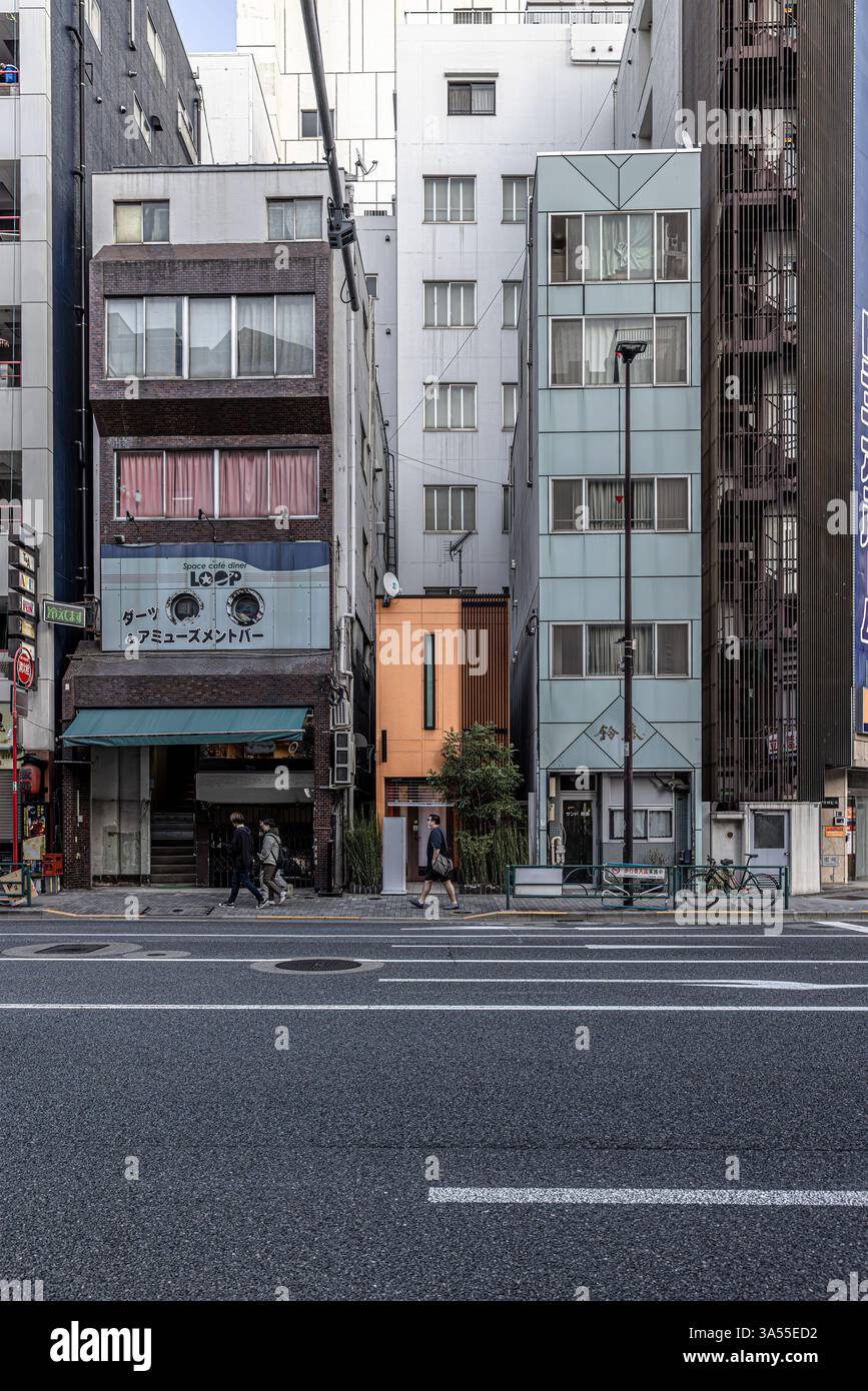 People walking on the sidewalk in tokyo, japan, passing buildings and shops Stock Photo - Alamy