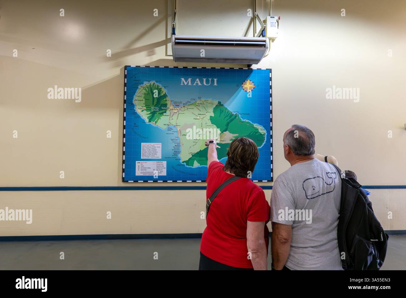 Tourist Look At The Maui Map In The Cruise Ship Terminal In Kahului ...