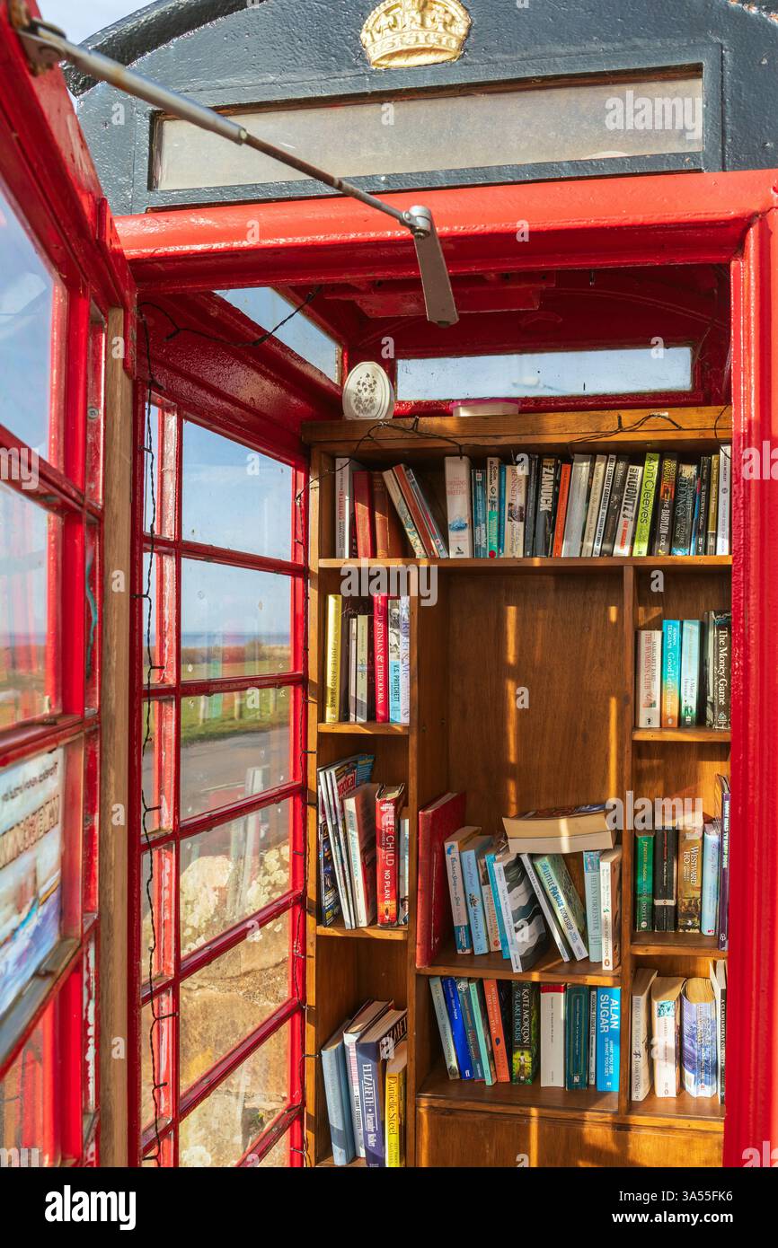 Old telephone box converted to a small community library. Maidens ...