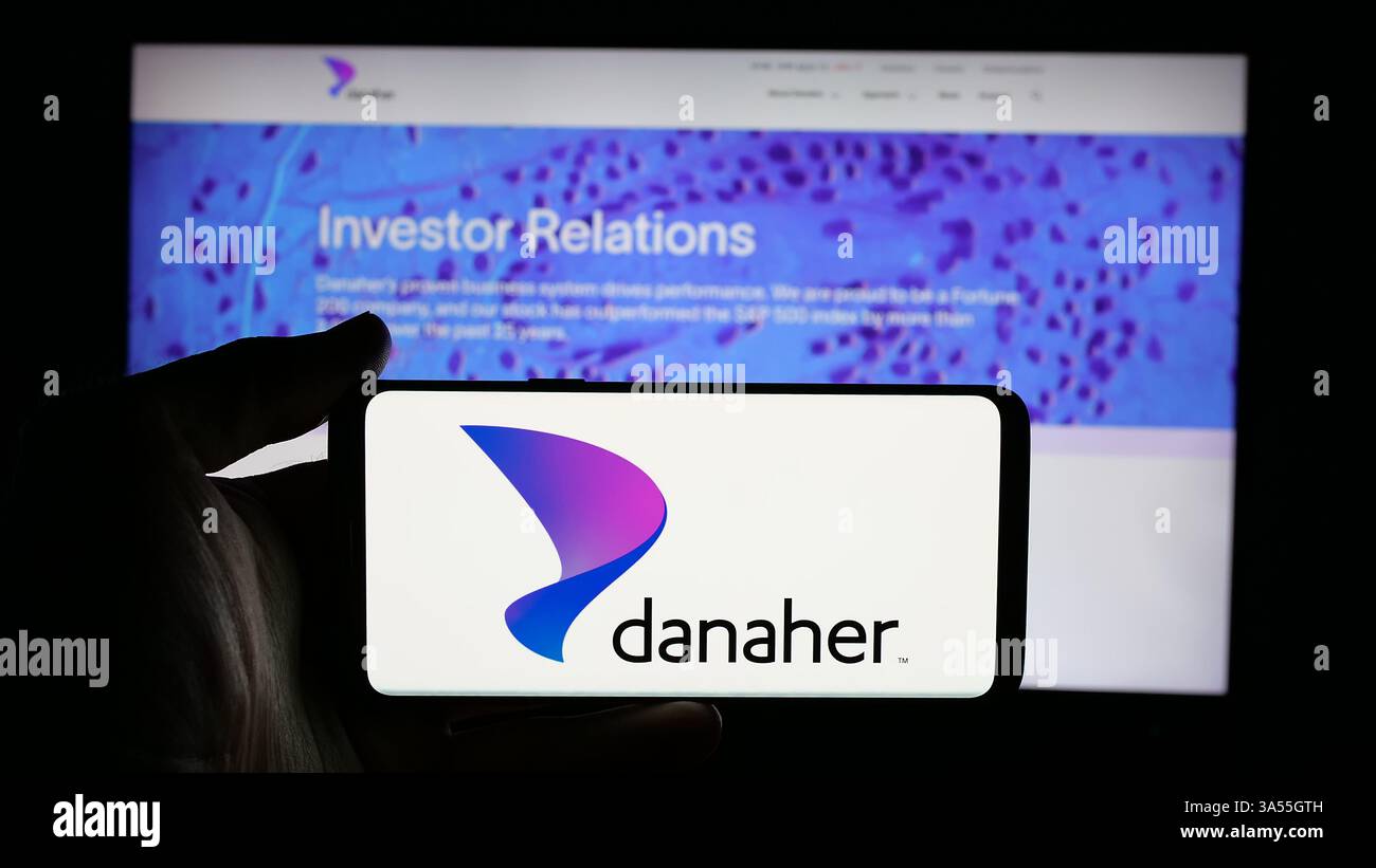 In this photo illustration, a cellphone with the logo of US life sciences company Danaher ...