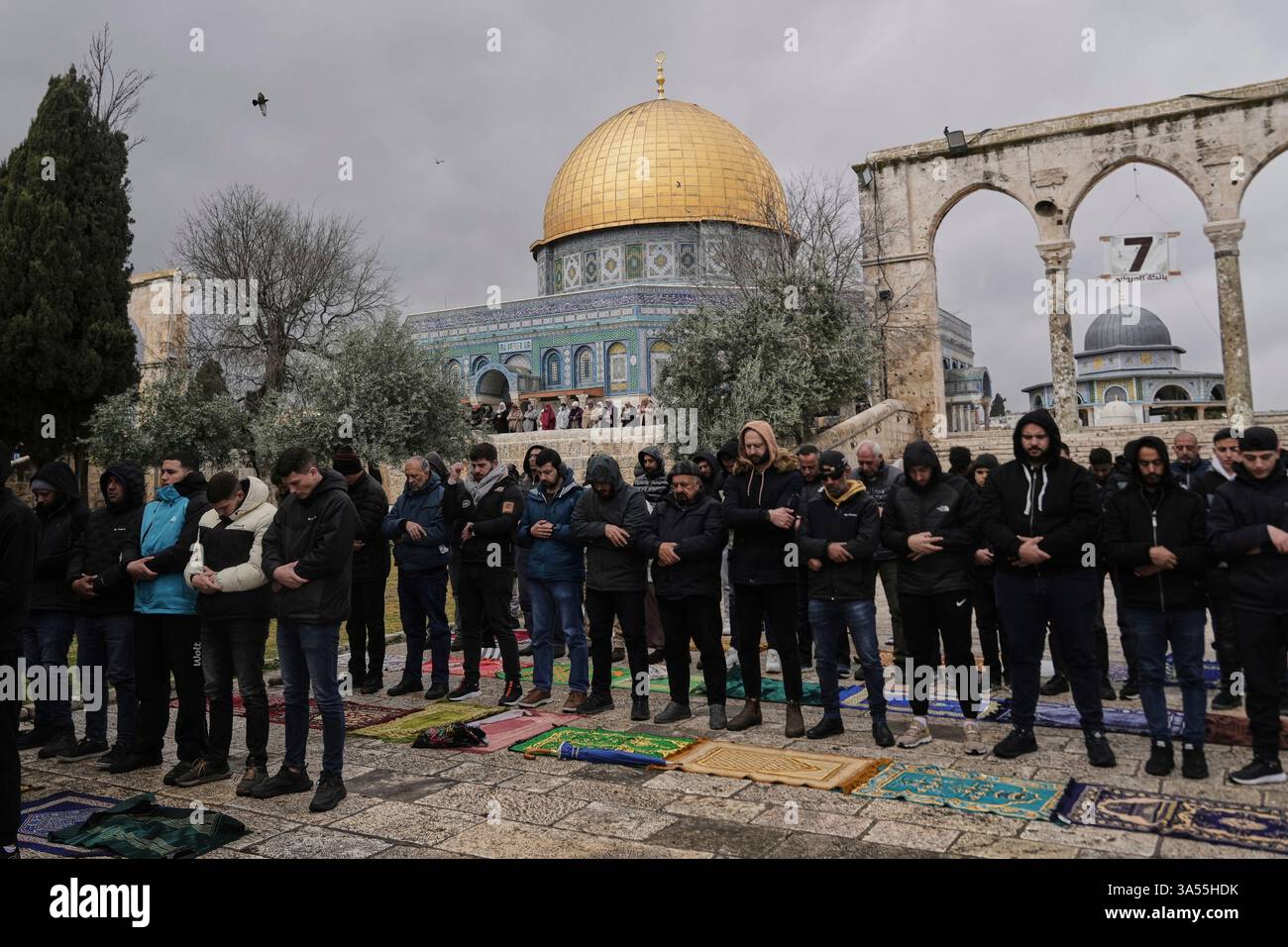 Palestinians perform Friday prayers at the Al-Aqsa Mosque compound in ...
