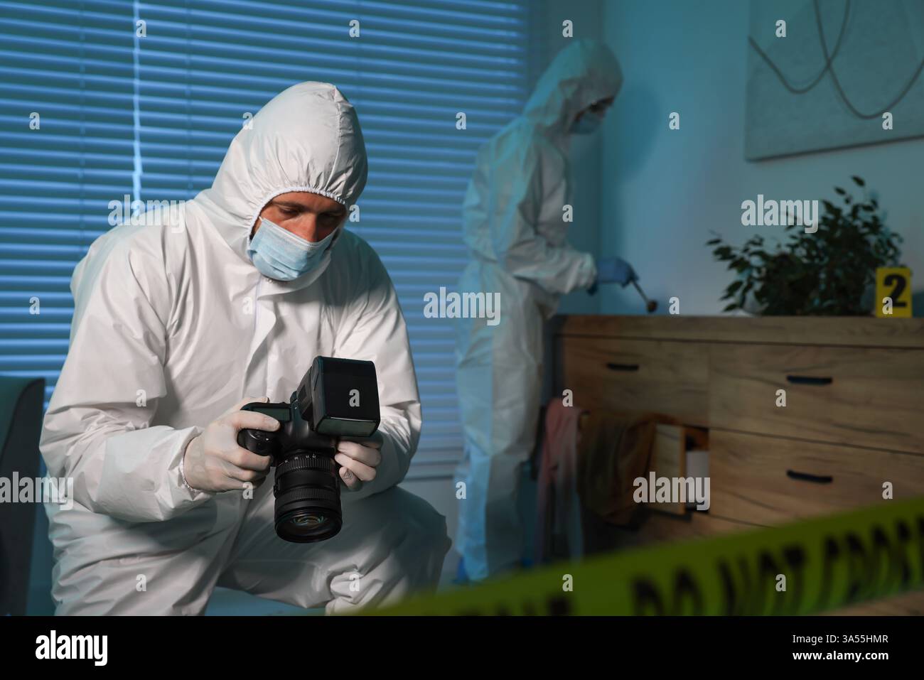 Forensic experts working at crime scene indoors Stock Photo - Alamy