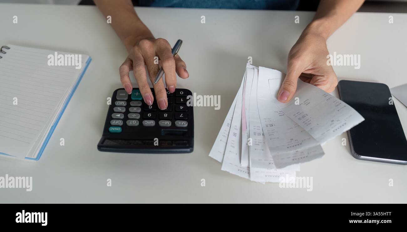 Budgeting and Expense Tracking. A person calculating expenses with ...