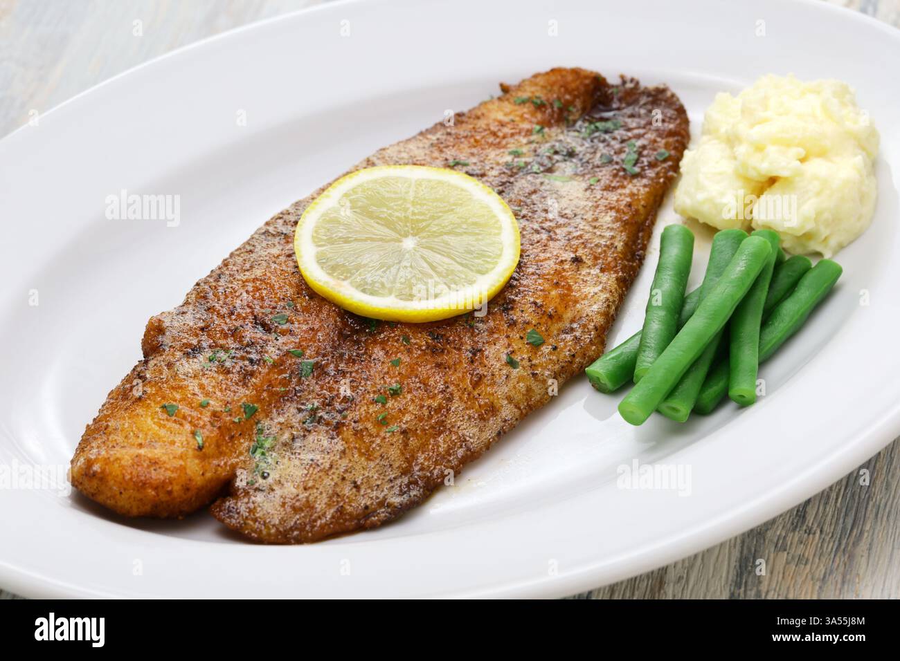 basa fish fillet cajun spiced meuniè Stock Photo - Alamy