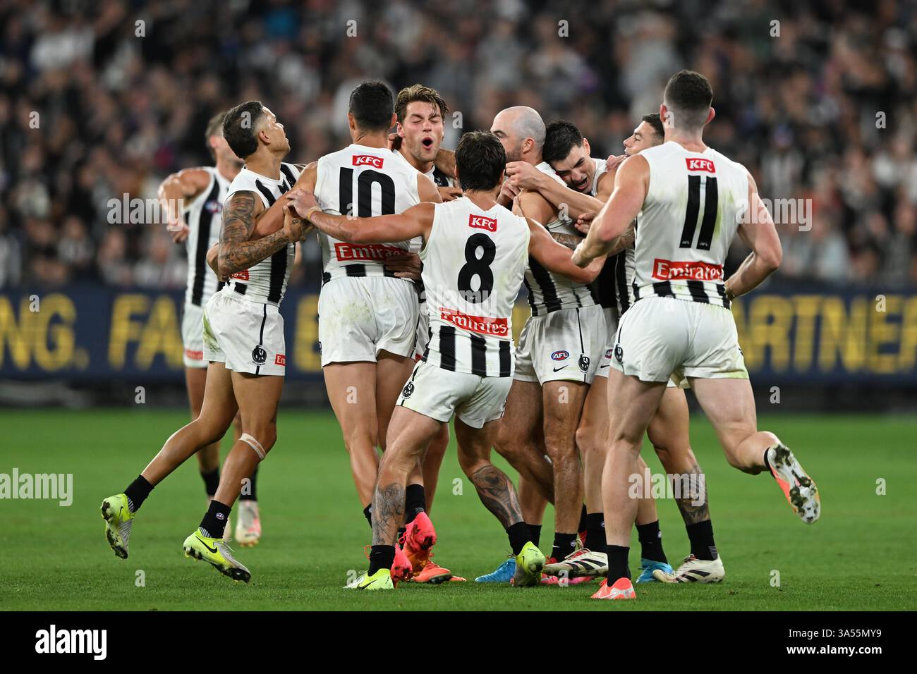 Patrick Lipinski of Collingwood (centre) celebrates the goal kicked by ...
