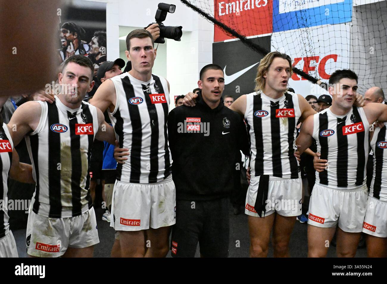 Reef McInnes of Collingwood (centre) is seen in the rooms after ...