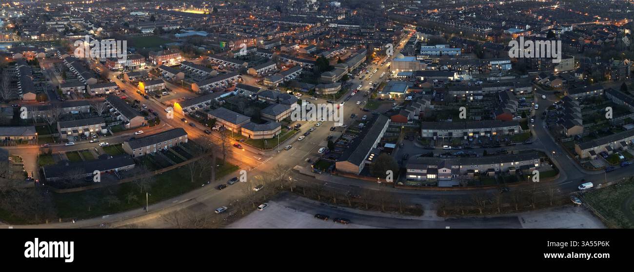 Panoramic aerial view of The L8 area of Liverpool at sunset, featuring ...