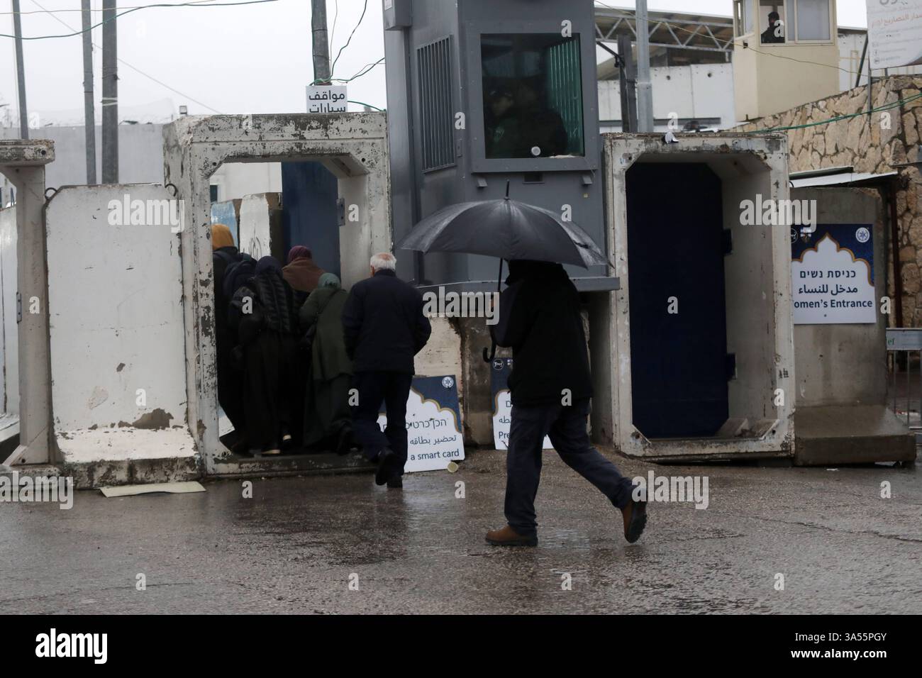 Palestinians, living in West Bank, gather at the Israeli military ...