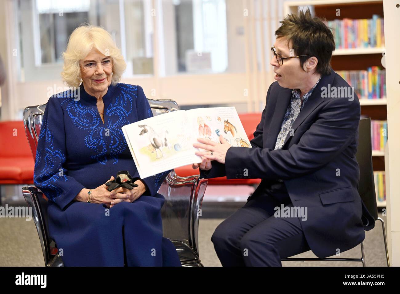 Queen Camilla views a book reading during a visit to Banbridge Library ...