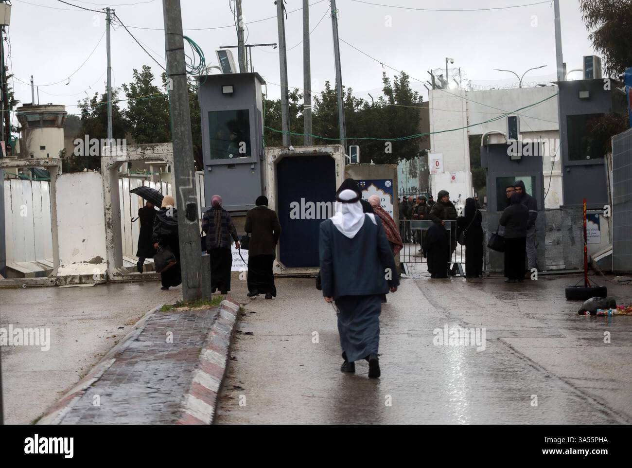 Palestinians, living in West Bank, gather at the Israeli military ...