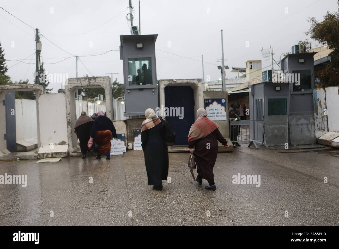 Palestinians, living in West Bank, gather at the Israeli military ...