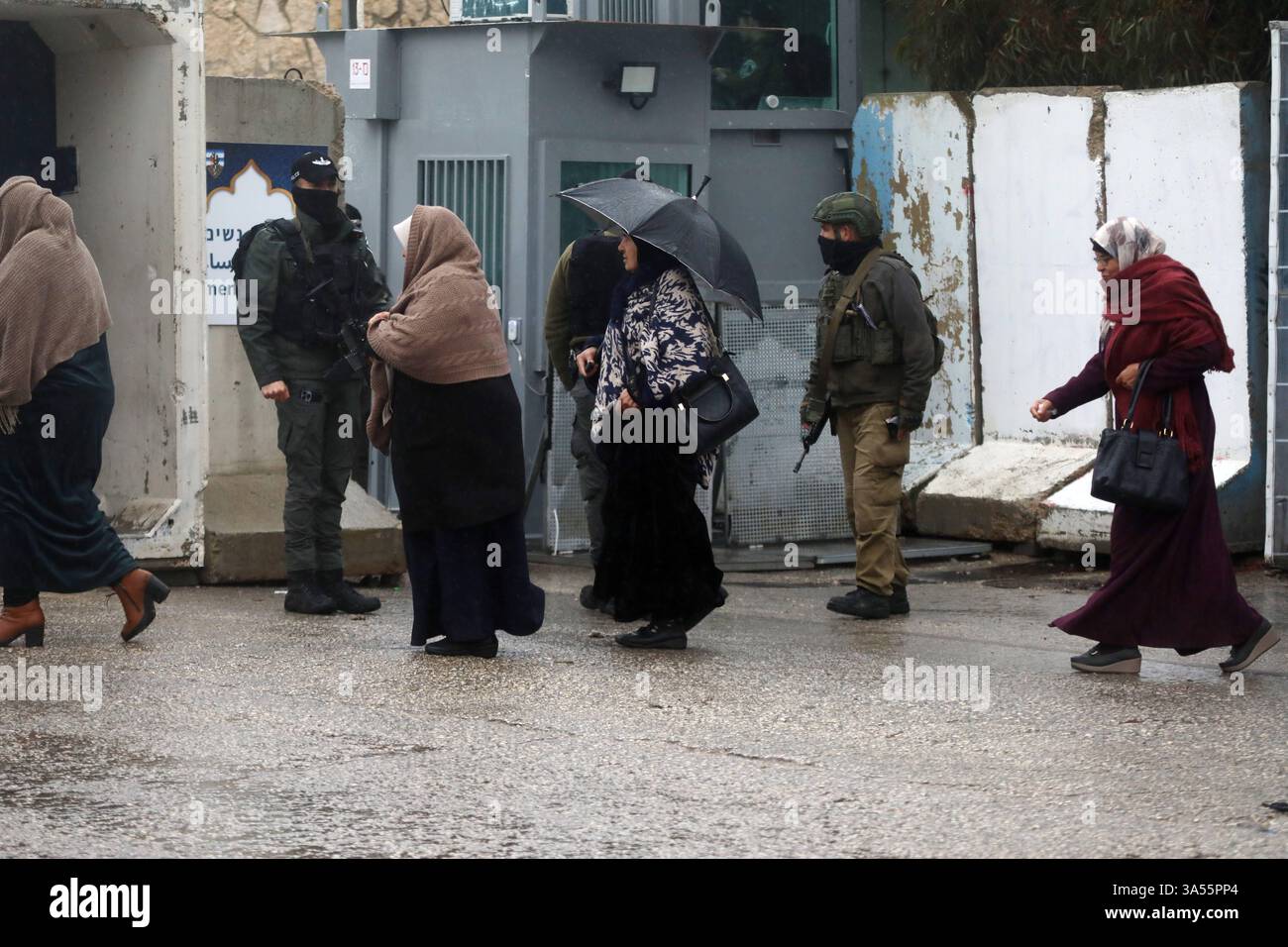 Palestinians, living in West Bank, gather at the Israeli military ...