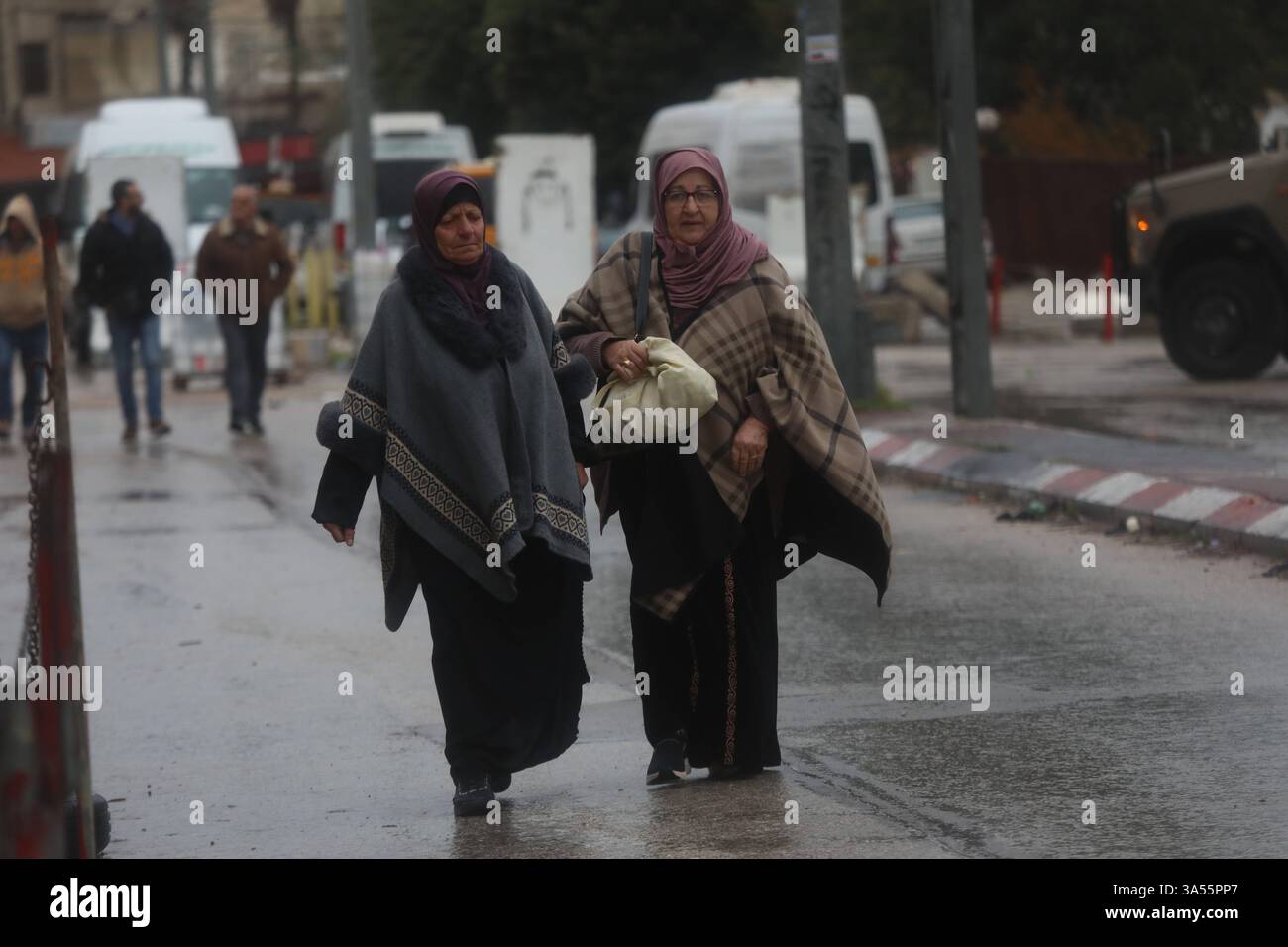 Palestinians, living in West Bank, gather at the Israeli military ...