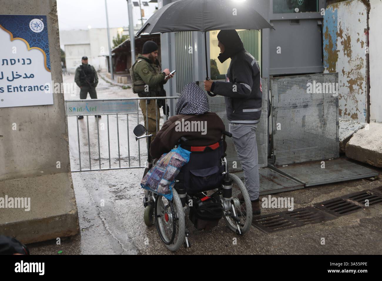 Palestinians, living in West Bank, gather at the Israeli military ...