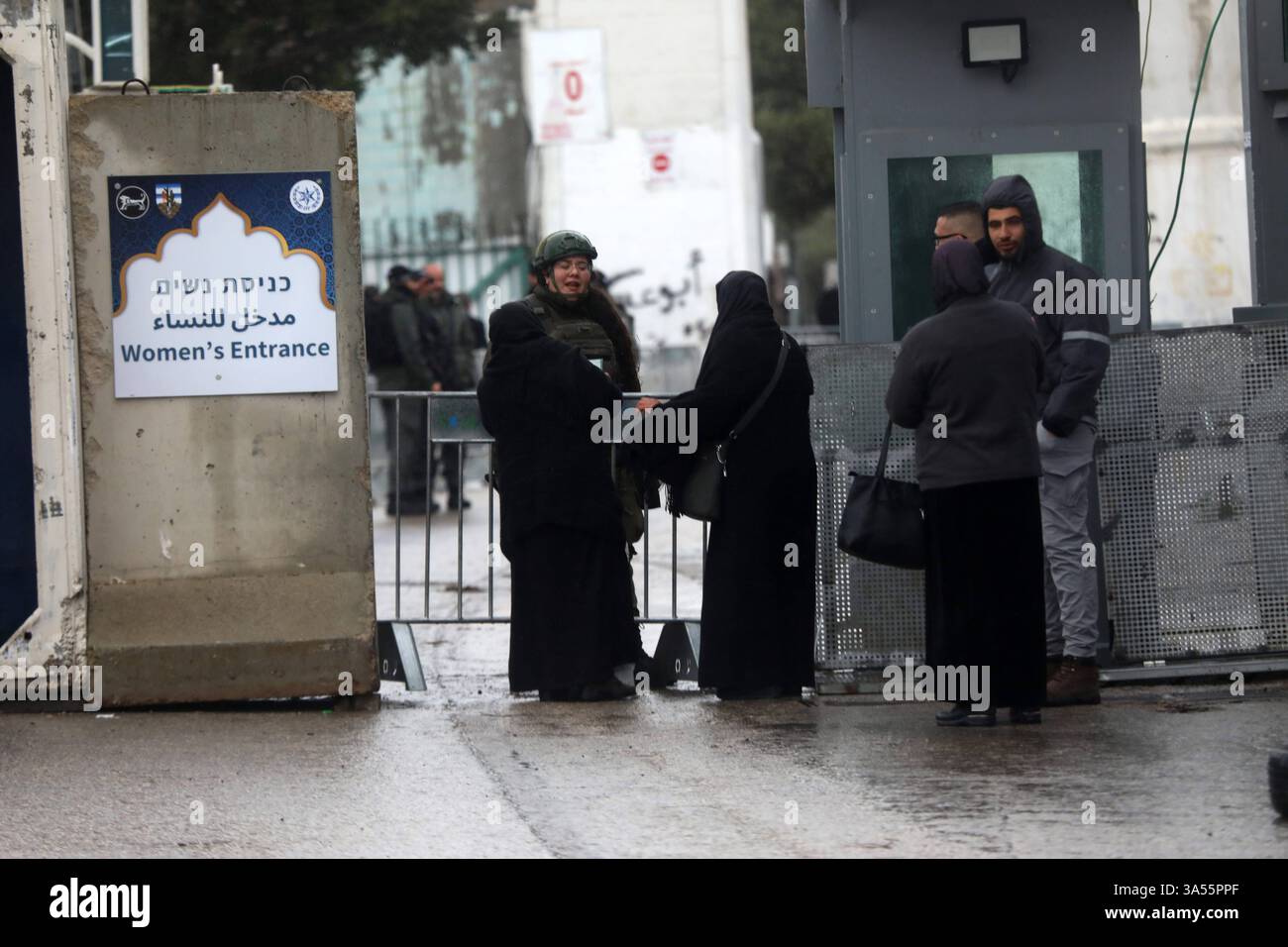 Palestinians, living in West Bank, gather at the Israeli military ...