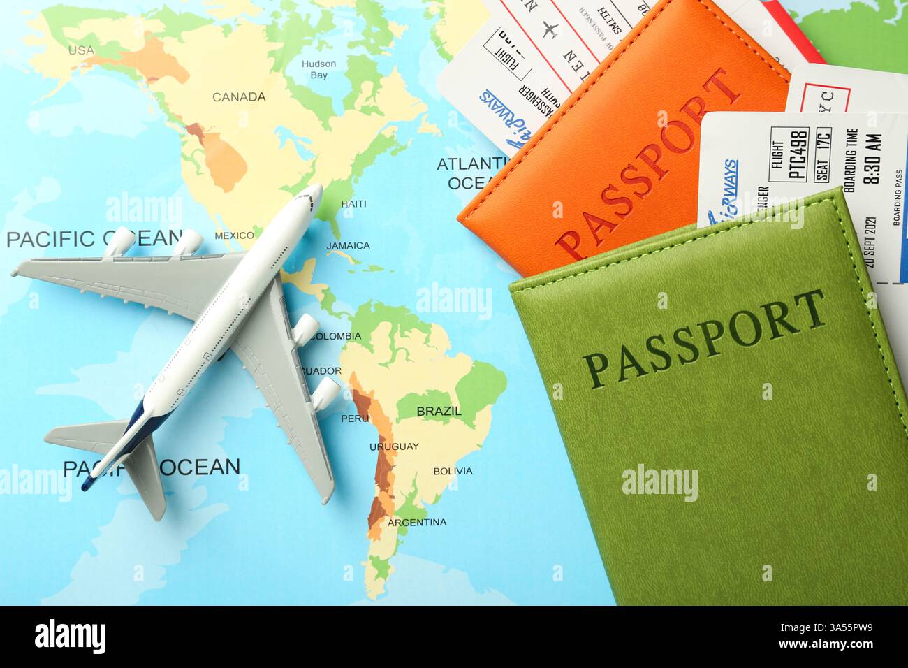 Passports with tickets and plane model on world map, top view Stock ...