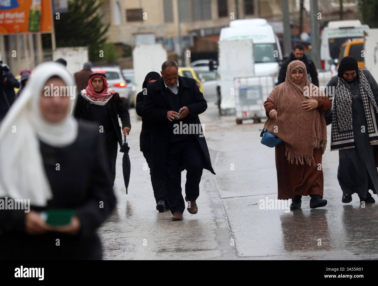 Palestinians, living in West Bank, gather at the Israeli military ...