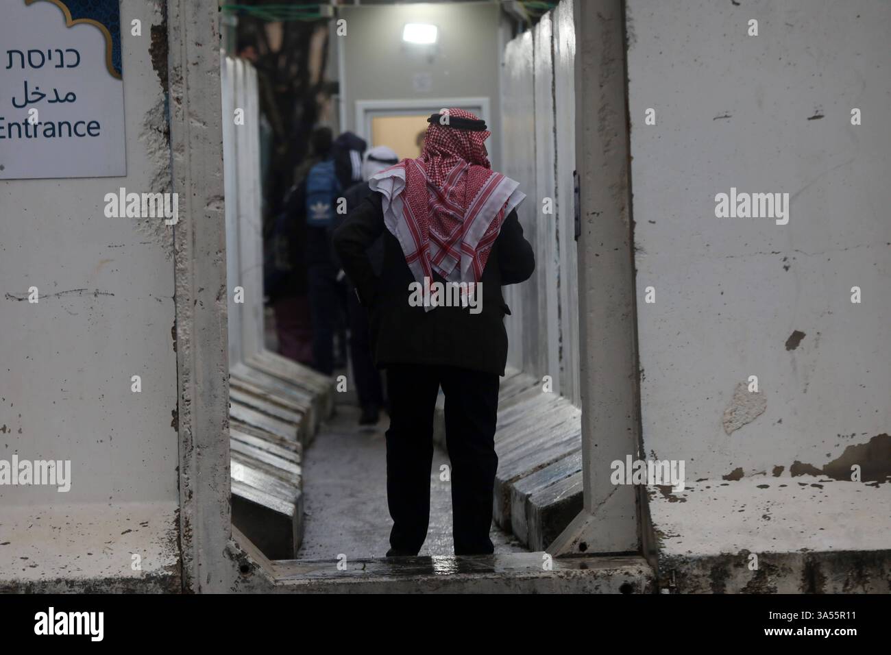 Palestinians, living in West Bank, gather at the Israeli military ...