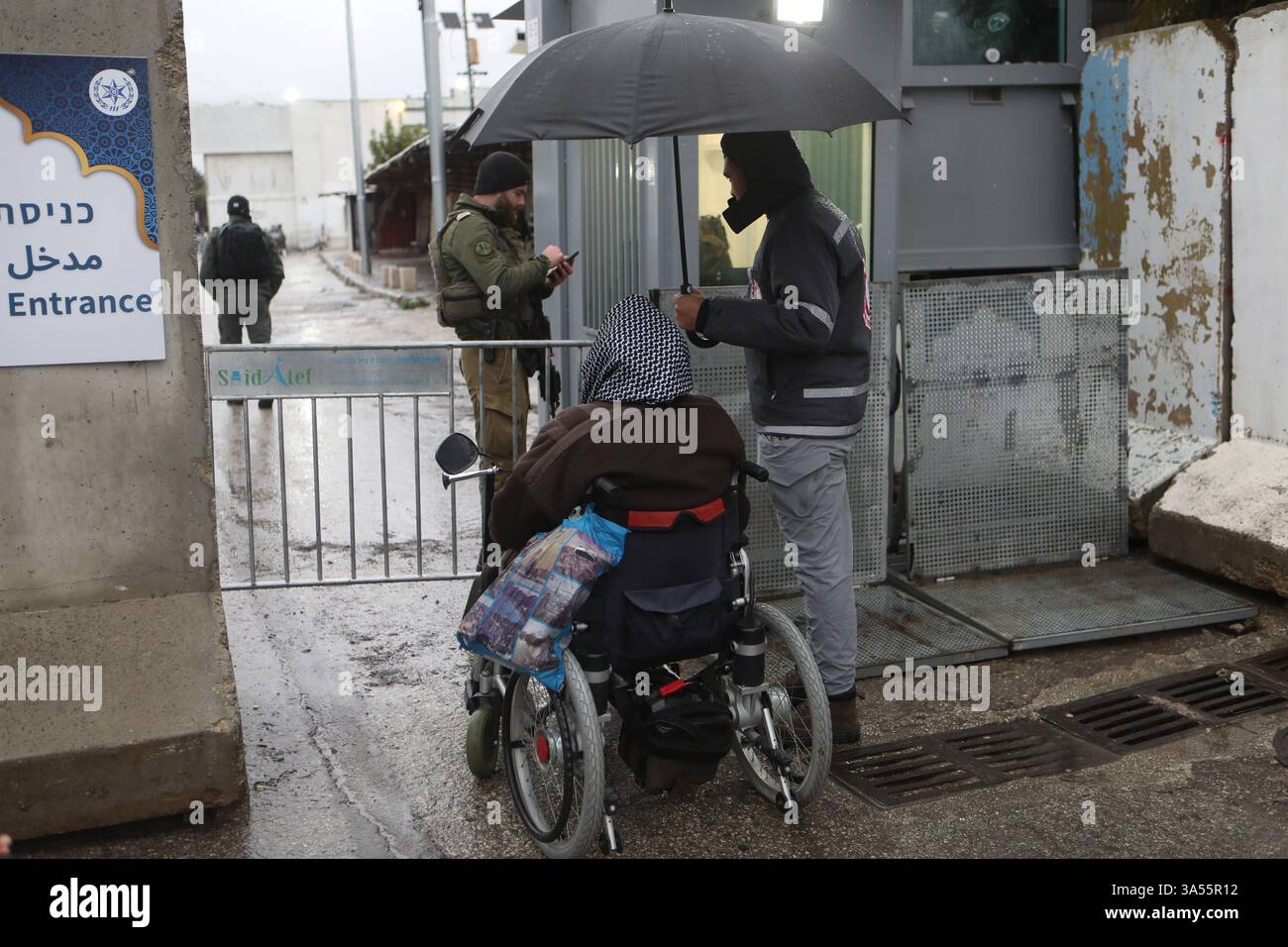 Palestinians, living in West Bank, gather at the Israeli military ...
