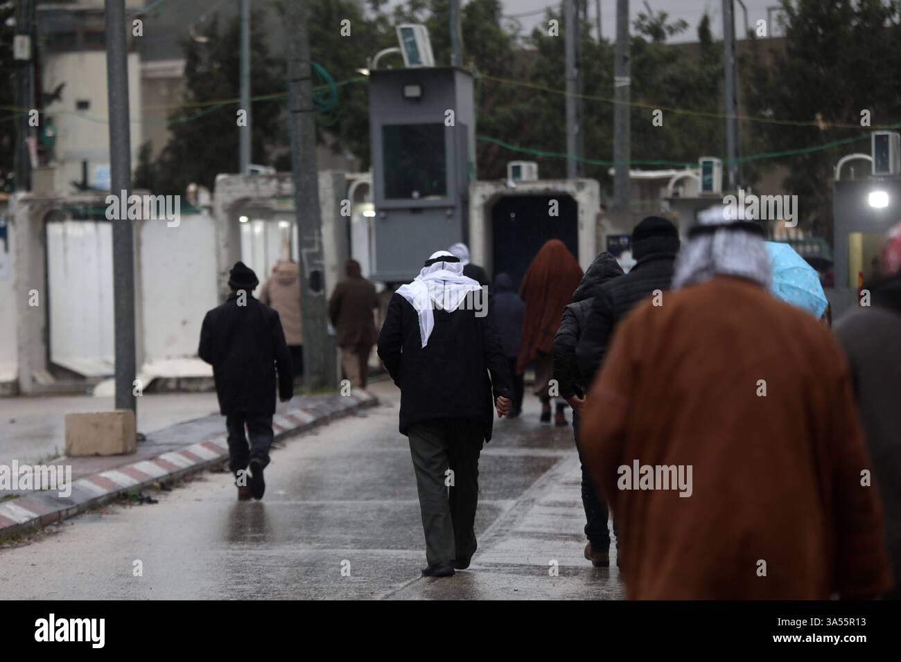 Palestinians, living in West Bank, gather at the Israeli military ...