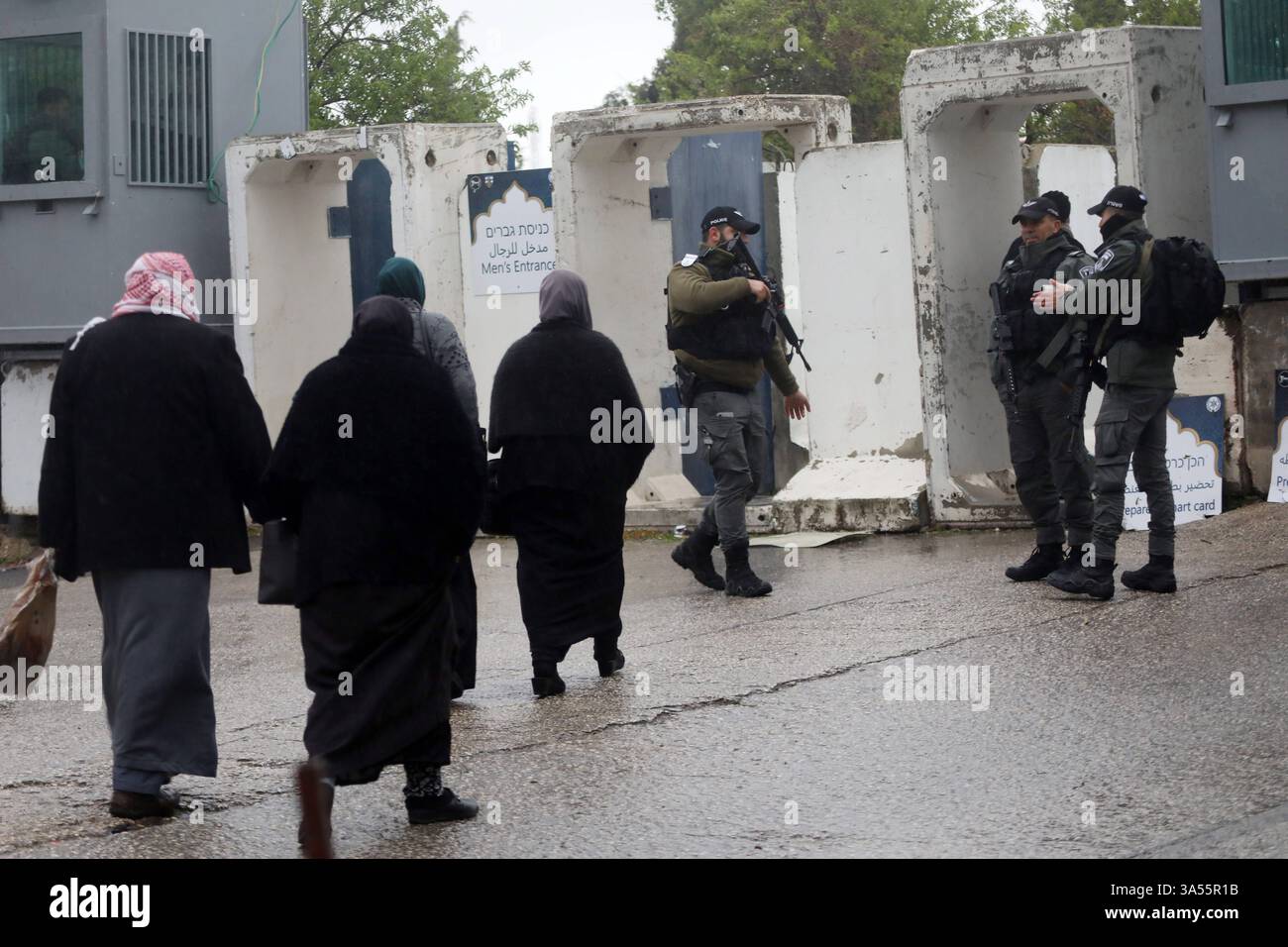 Palestinians, living in West Bank, gather at the Israeli military ...