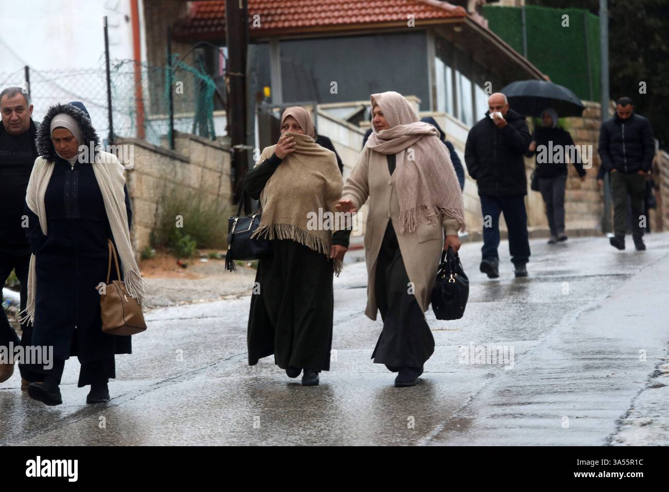 Palestinians, living in West Bank, gather at the Israeli military ...