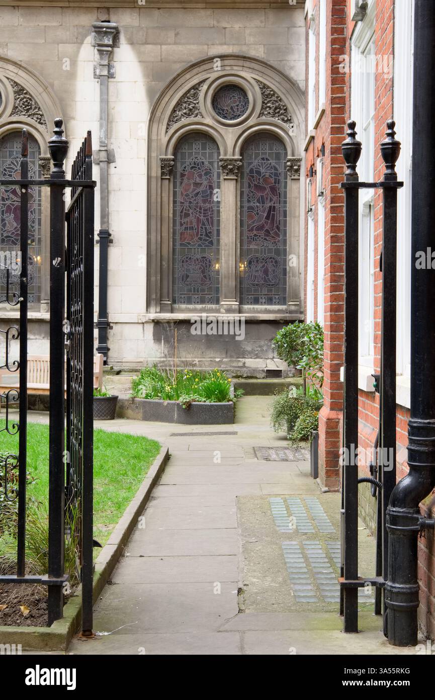 Stained glass arched window of St Michael Cornhill church in the City ...