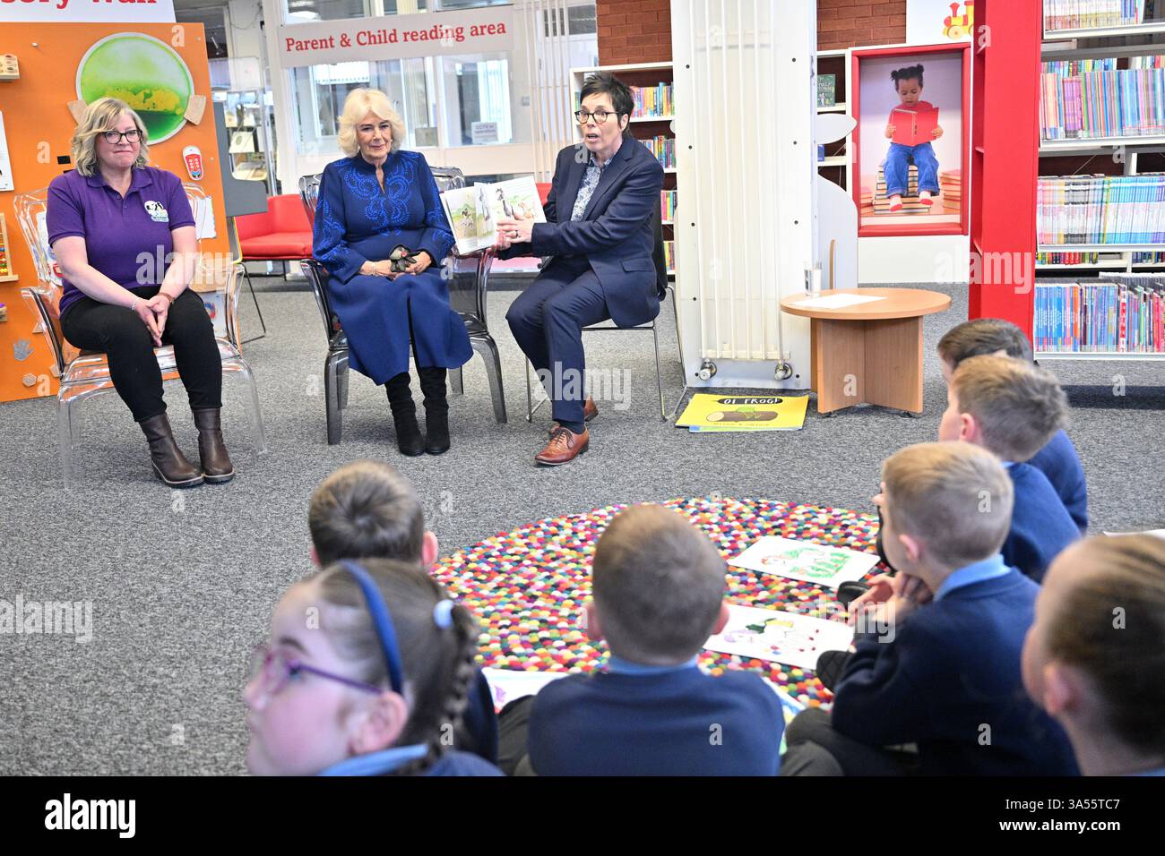 Queen Camilla views a book reading during a visit to Banbridge Library ...