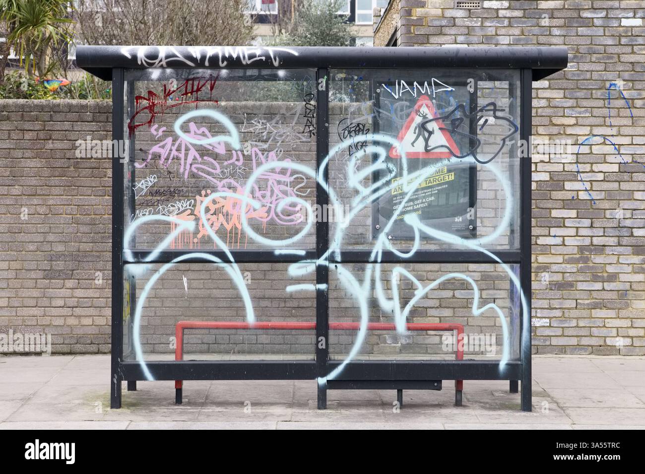 Graffiti covered bus shelter on Elkstone Road, Kensal Town, London ...