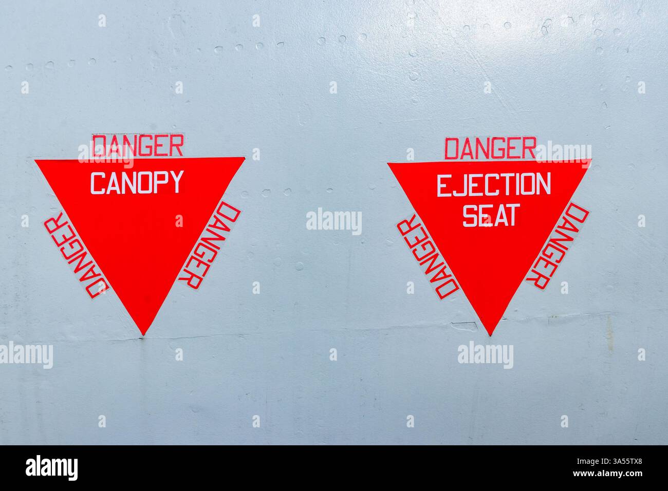 Red triangular warning sign displaying the words danger canopy ...