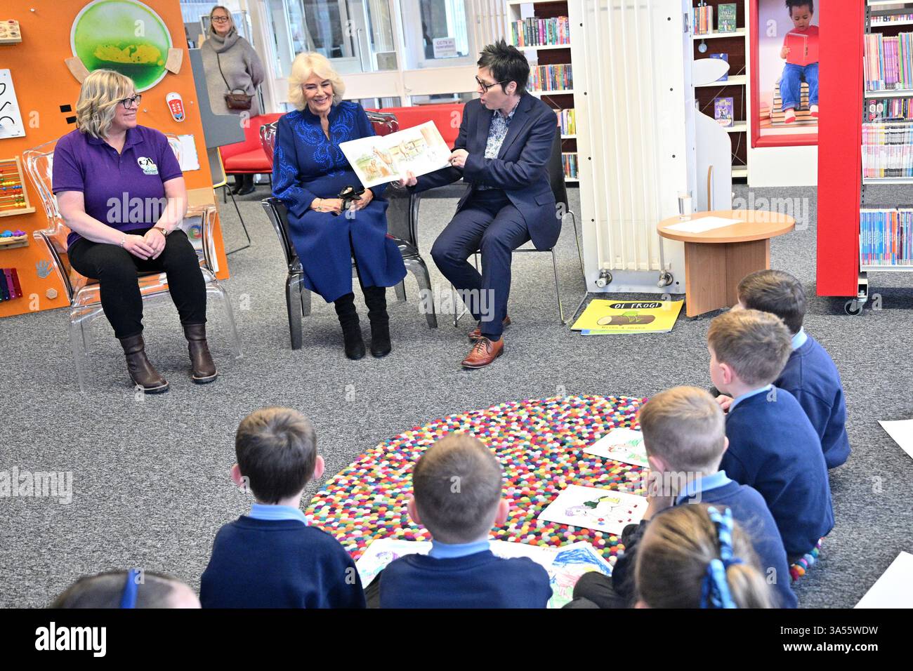 Queen Camilla views a book reading during a visit to Banbridge Library ...