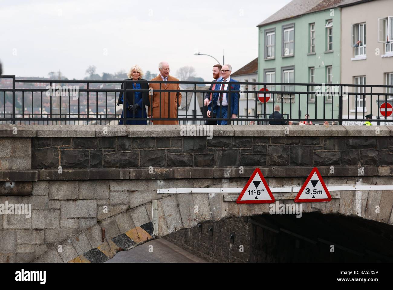 King Charles III and Queen Camilla stand on the Rathfriland Street ...