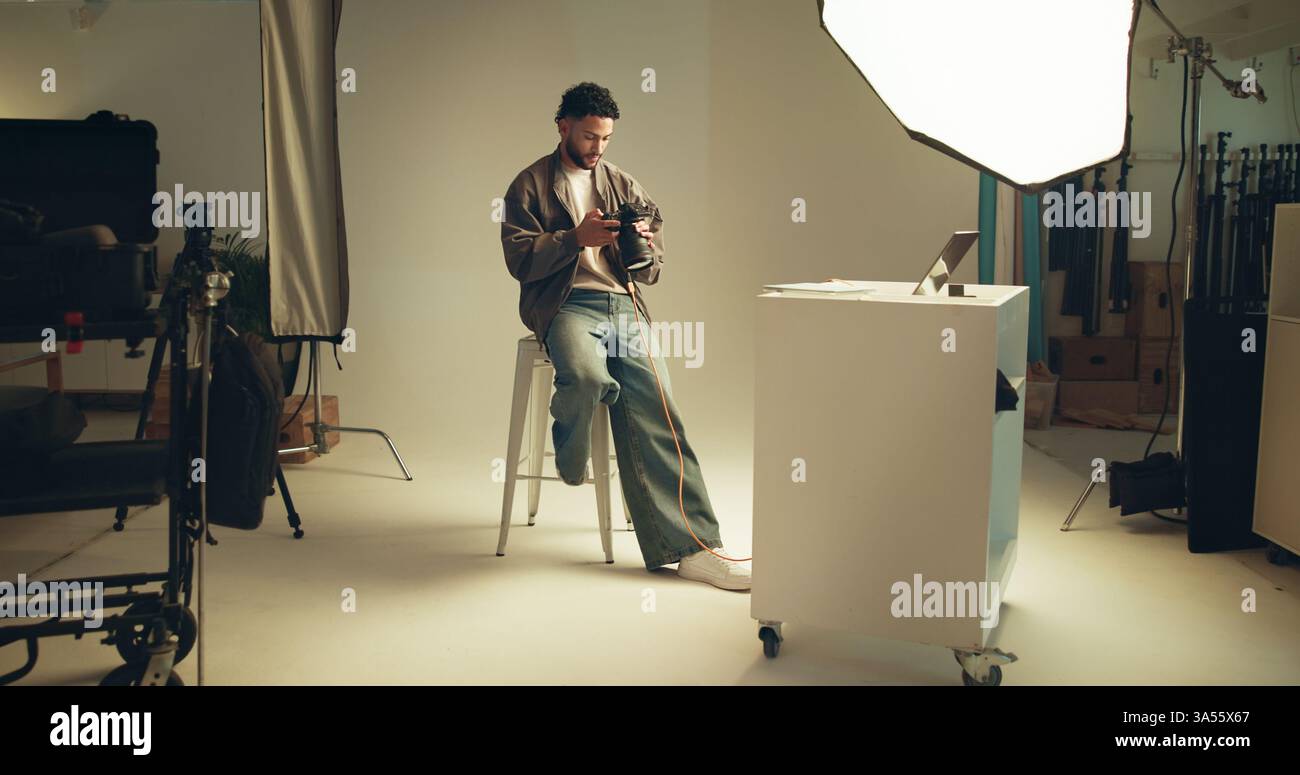 Photoshoot, studio and photographer with camera review on set for ...