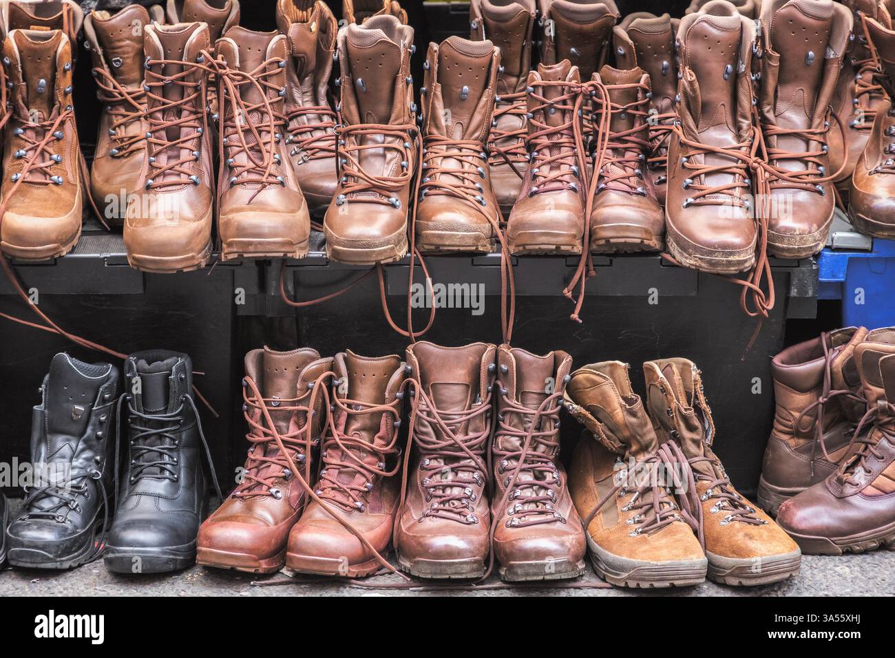 Secondhand combat brown boots on display at Brick Lane Sunday market in ...
