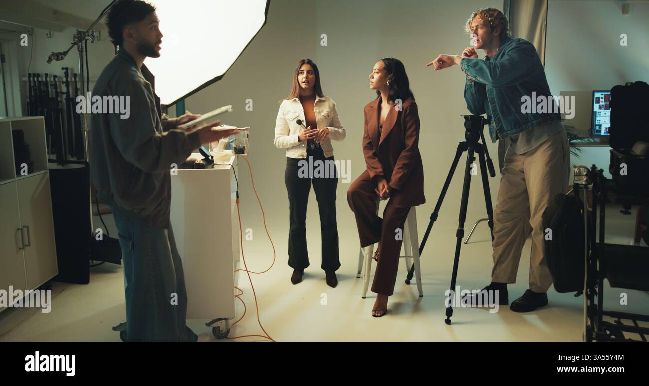 Makeup artist, model and photographer together in studio for discussion ...