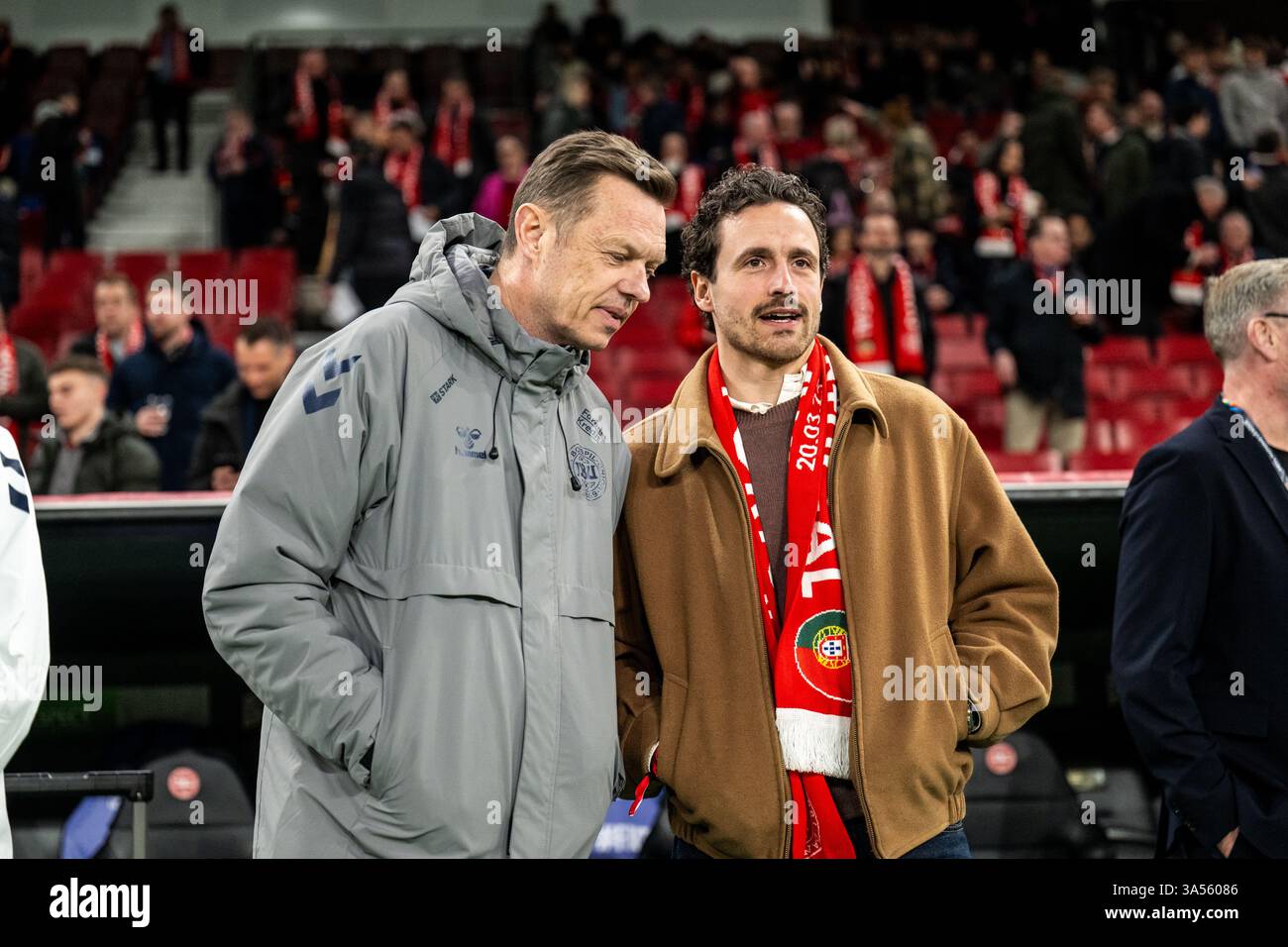 Copenhagen, Denmark. 20th, March 2025. Former Danish international Thomas Delaney (R) seen ...
