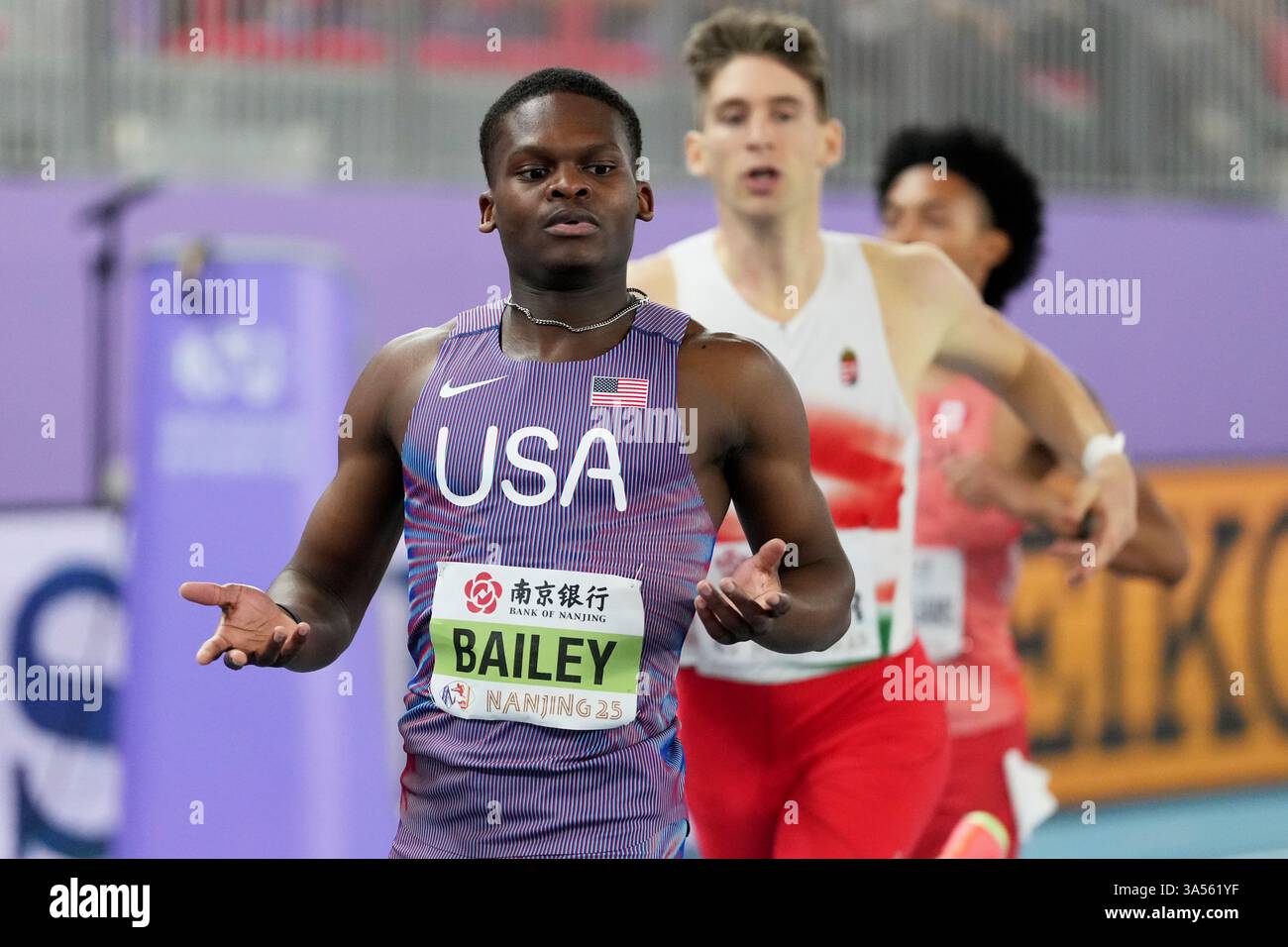 Christopher Bailey, of the United States, crosses the finish line to ...