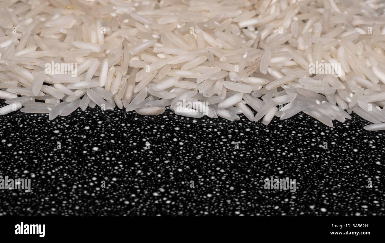 Horizontal abstract wallpaper with raw white rice and grainy dark ...