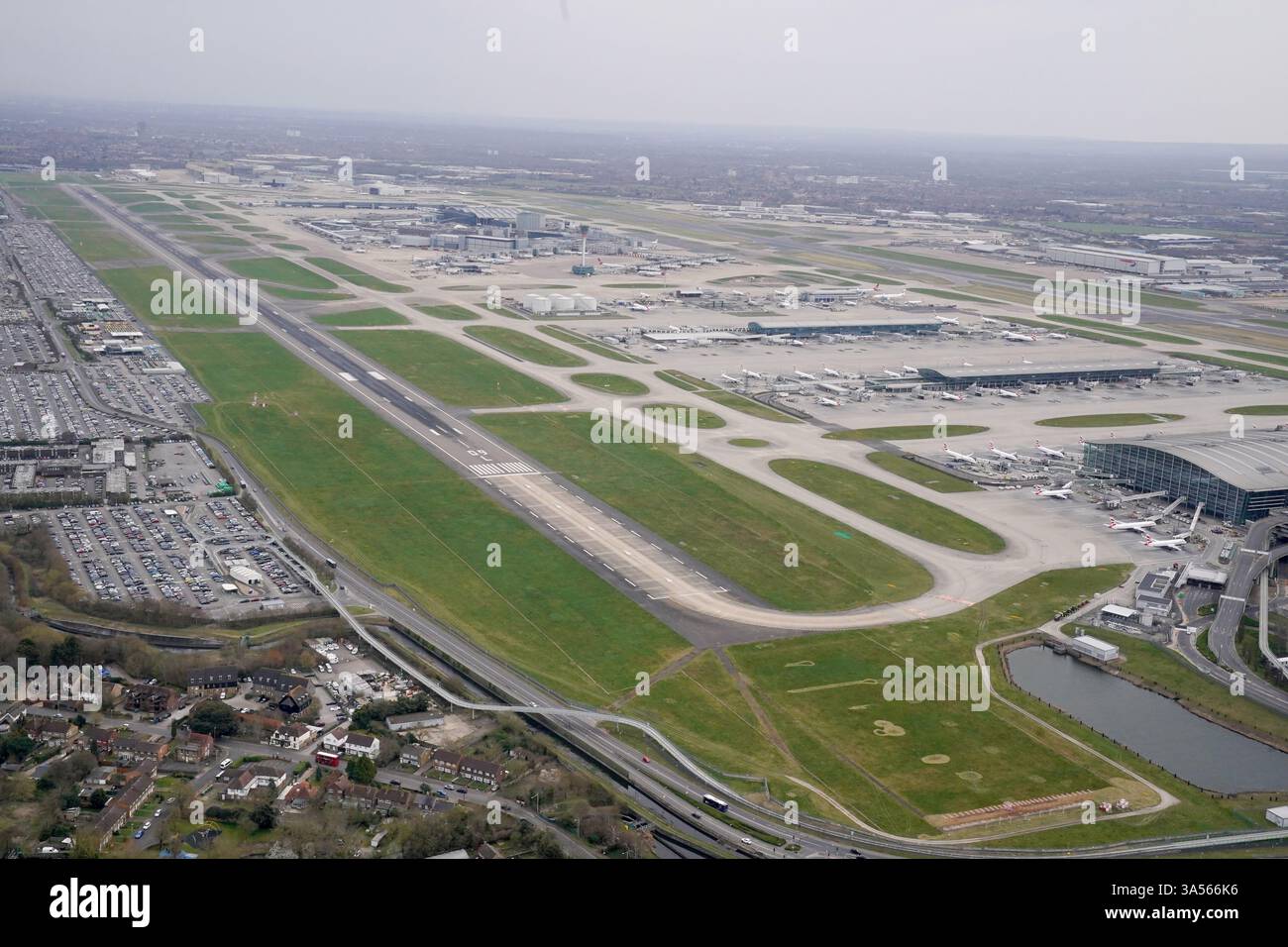 An empty runway at Heathrow Airport. More than 1,300 flights to and ...