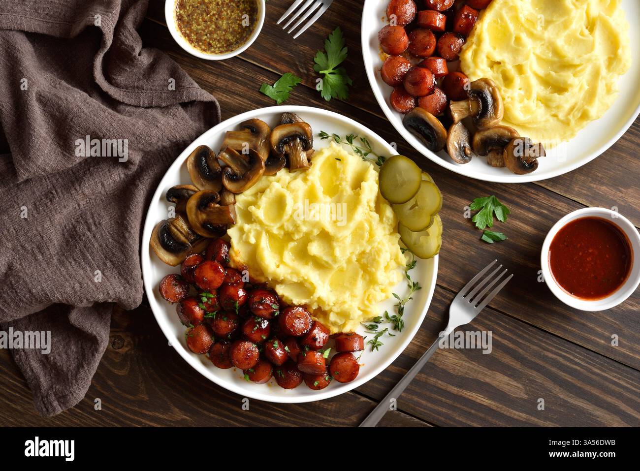 Potato puree with roasted sweet and spicy sausage bites and mushrooms ...