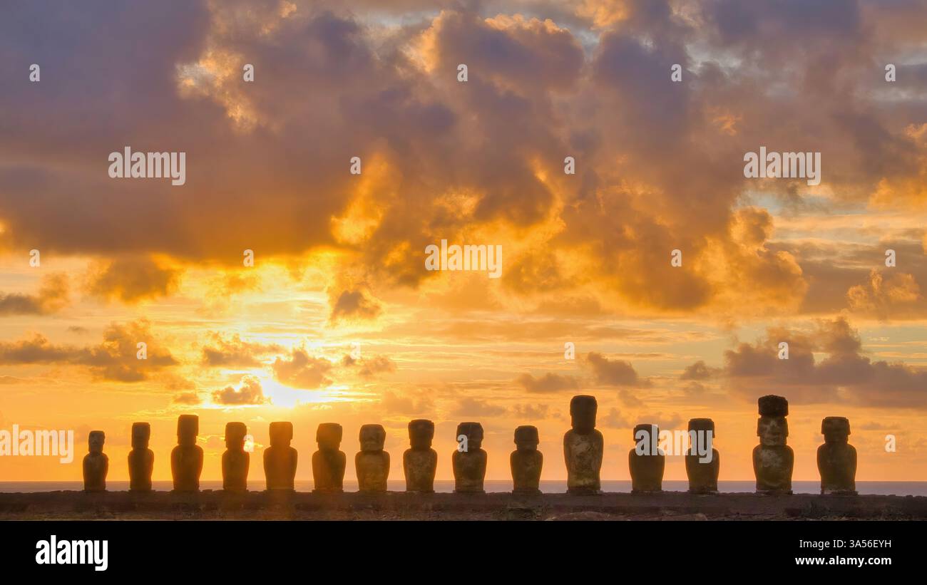 Sunrise behind the fifteen moai atop the largest ahu or stone platform ...